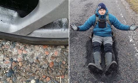 Motorist Climbs Inside Giant Pothole That Smashed His Car Daily Mail