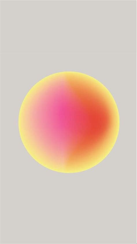 An Orange And Pink Circle On A Gray Background