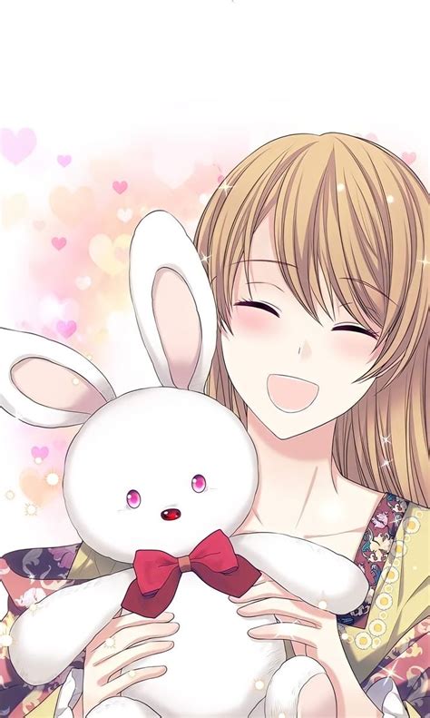 A Woman Holding A White Rabbit In Her Arms