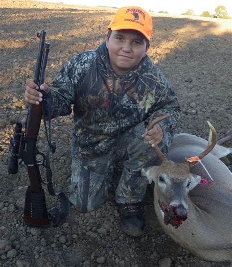 Outdoors Columnist Tom Lounsbury Admires Various Deer Rifles And