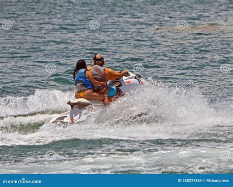Couple Riding Tandem N A Speeding Jetski Stock Photo Image Of Coastal
