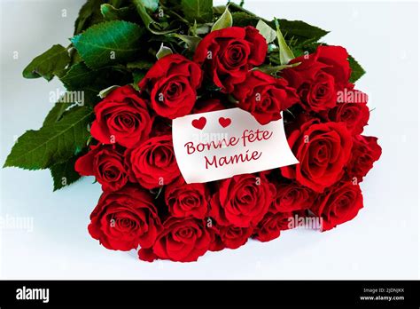 Bouquet of red roses With card Bonne Fête Mamie in French Stock