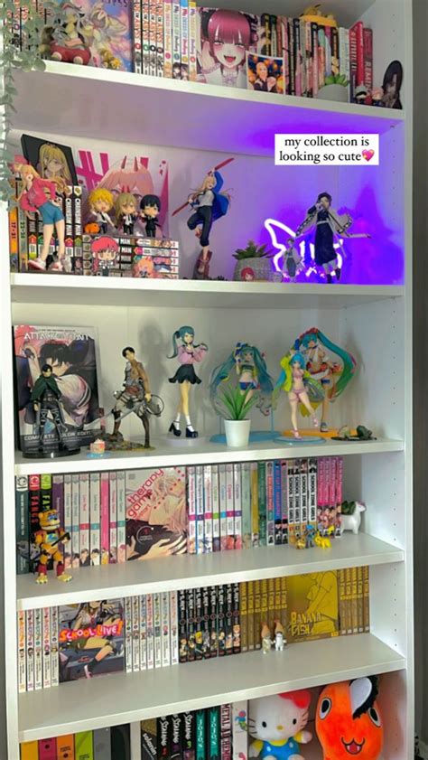 A White Book Shelf Filled With Lots Of Anime Figurines And Books On Top