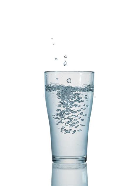 Fresh Clean Water Pouring Into Glass Isolated On White Stock Image