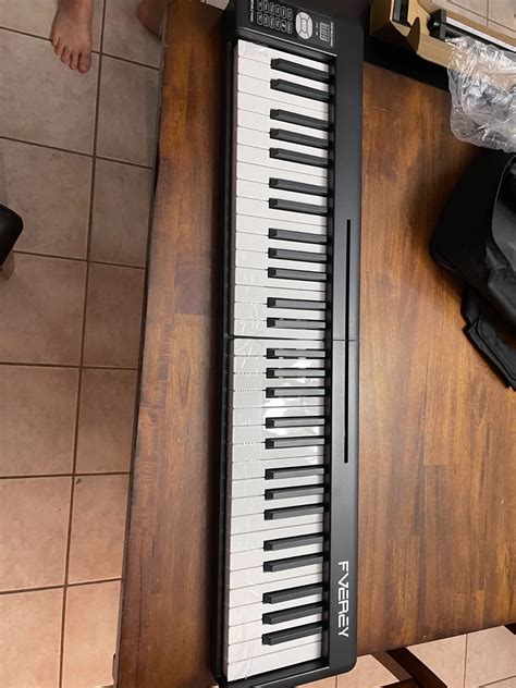 30 Mo Finance FVEREY 61 Key Folding Piano Keyboard Semi Weighted