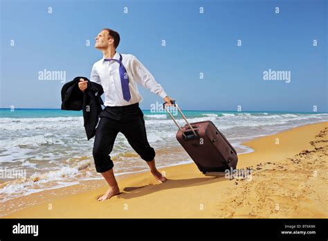 Man Carrying A Suitcase High Resolution Stock Photography And Images