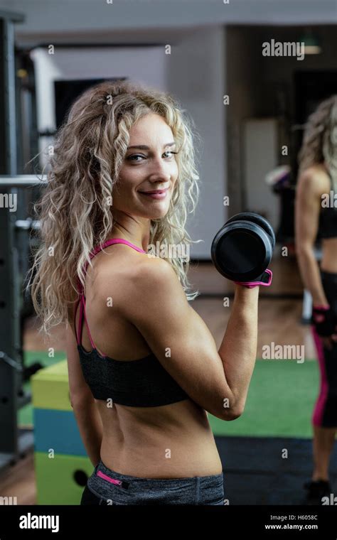 Beautiful Woman Lifting Dumbbell Stock Photo Alamy