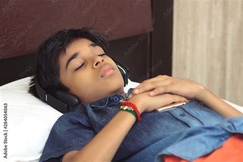 Indian Teen Boy Fell Asleep On Bed Stock Photo Adobe Stock