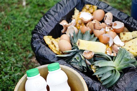 Closeup Food Scraps For Making Compost And Bottles Of Fertilizer