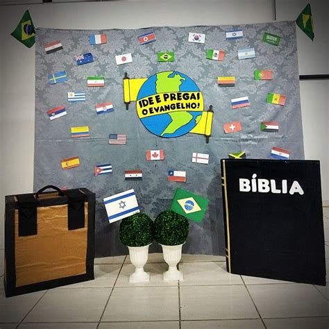 There Is A Bulletin Board With Flags On It And Two Suitcases Next To It