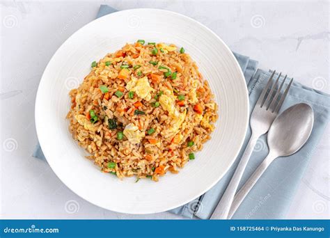 Asian Chinese Fried Rice With Scrambled Eggs And Vegetables Stock Photo