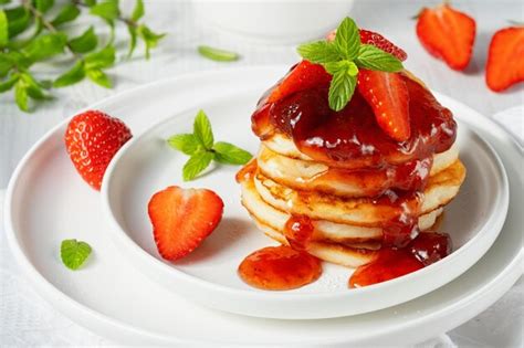 Premium Photo Mini Pancakes With Strawberry Jam And Strawberries