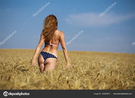 Sexy Woman In Sexy American Flag Bikini In A Wheat Field Stock Photo