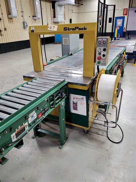 USED STRAPACK MODEL RQ 8 AUTOMATIC STRAPPING MACHINE Harris Machine