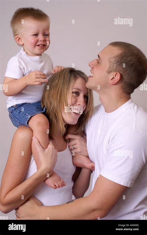Son On Mom S Shoulders Stock Photo Alamy