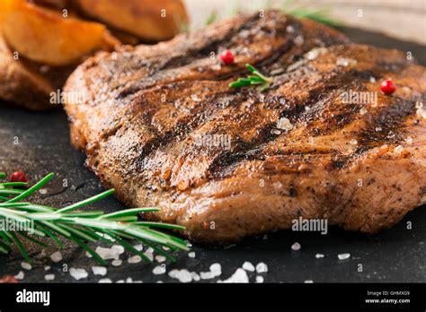 Beef Steak With Baked Potato And Sauce Stock Photo Alamy