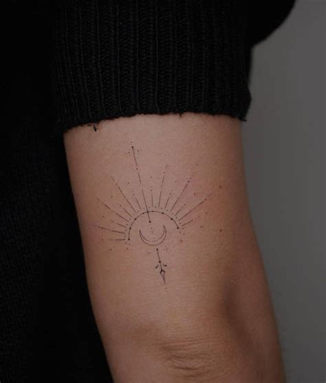 Ornamental Sun And Moon Tattoo On The Tricep