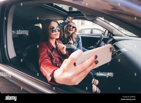 Group Of Girls Having Fun With The Car Taking Selfie Play Couples