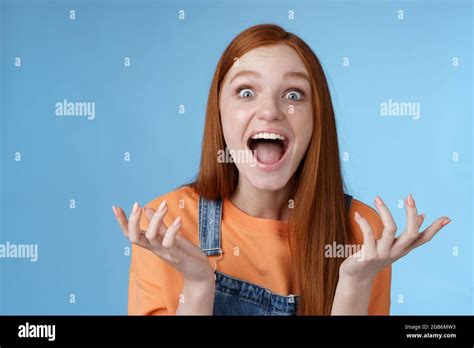 Extremely Happy Good Looking Caucasian Redhead Girl Reacting Awesome Fantastic News Shouting