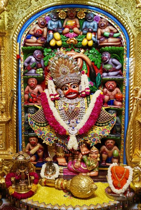 An Idol Is Displayed In Front Of A Shrine