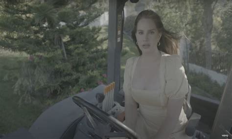 Lana Del Rey Rides A Tractor Decorates Cakes In Blue Banisters Video