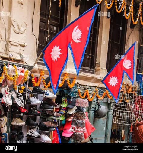 Nepali Flags Hang Outside A Shoe Shop In Kathmandu Nepal Stock Photo