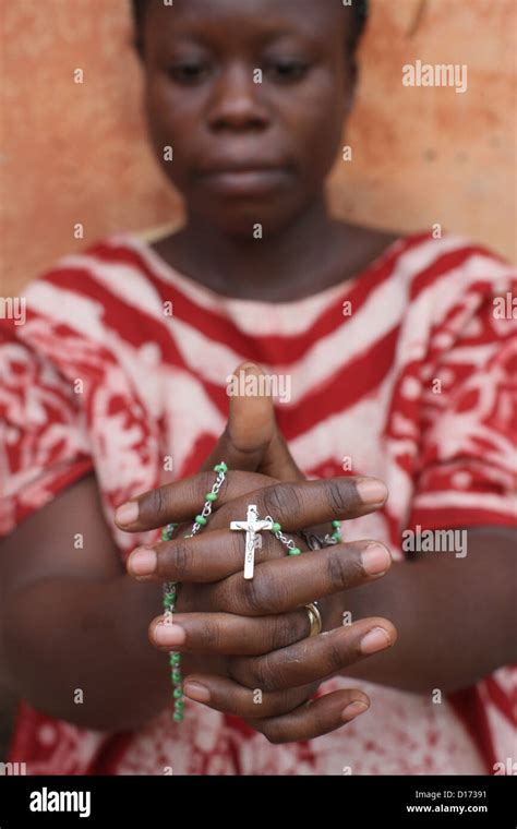 African Woman Praying The Rosary Stock Photo Alamy
