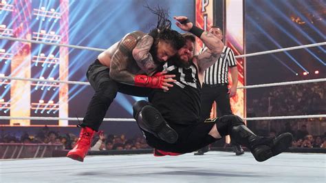 Undisputed WWE Tag Team Champions Kevin Owens Sami Zayn Def Roman