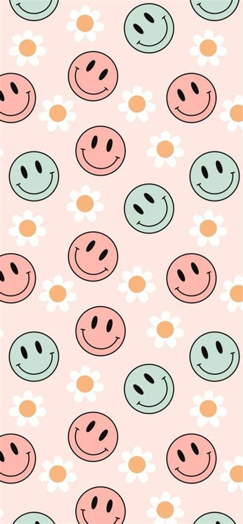 A Pink Background With Smiley Faces And Daisies On The Bottom In