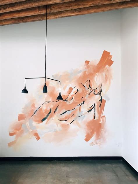 An Abstract Painting On The Wall With Three Lamps Hanging From It S