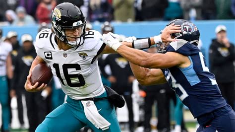 Jacksonville Jaguars Quarterback Trevor Lawrence Stiff Arms Defender On