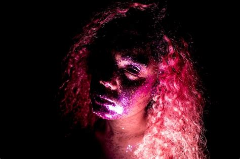 Premium Photo Portrait Of Woman With Glitter Make Up Against Black