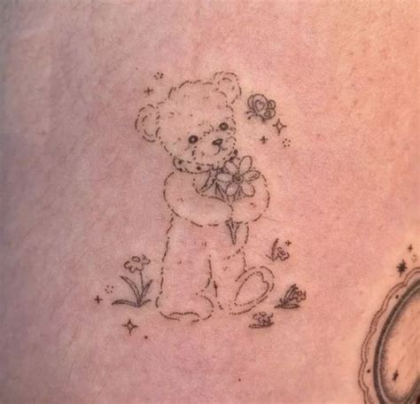 A Small Teddy Bear Tattoo On The Stomach