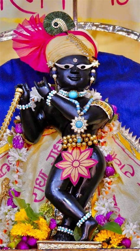 An Idol Is Displayed In Front Of A Sign