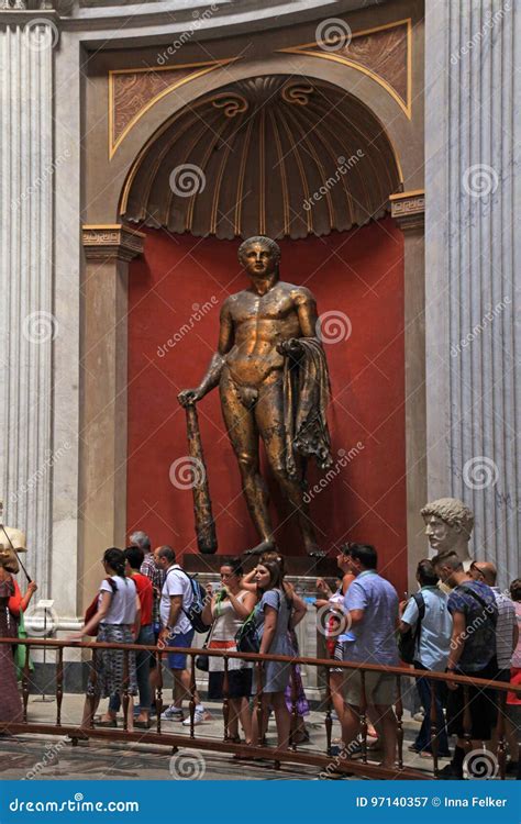 Tourists And Hercules Sculpture In Vatican Museums Rome Italy
