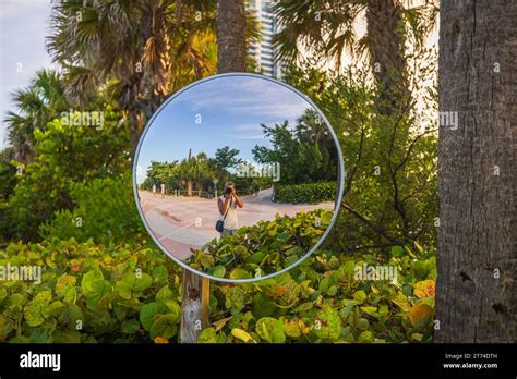 Man Captures His Reflection In Convex Traffic Safety Mirror Against