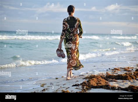 Women Walking On Beach In Sunset Stock Photo Alamy