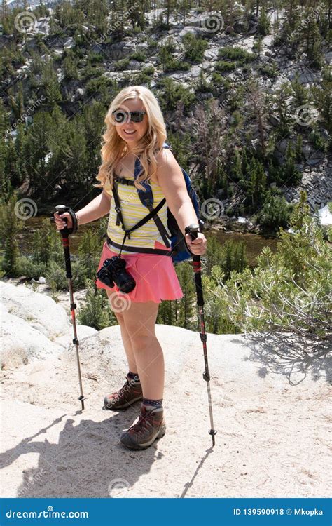 Blonde Female Stands On A Boulder In The John Muir Wilderness In The Eastern Sierra Little Lakes