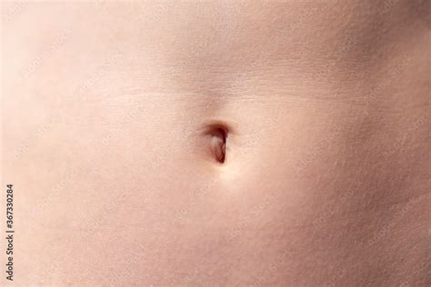 Navel of a teenage girl front view close up Stock 写真 Adobe Stock