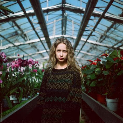 A Beautiful Blond Woman In A Greenhouse By Stocksy Contributor Anna