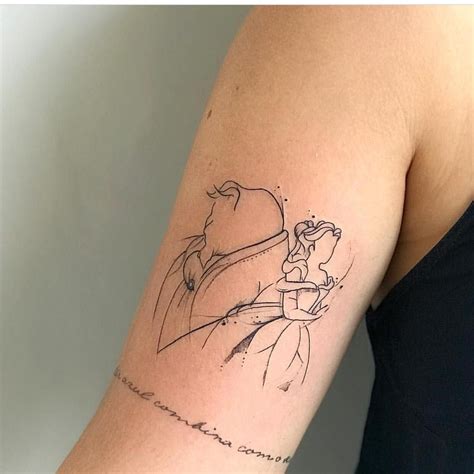 A Woman With A Tattoo On Her Arm