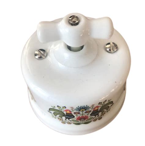 Włącznik ceramiczny obrotowy natynkowy pojedynczy biały ze zdobieniem