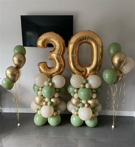 Balloons And Streamers Are Arranged In The Shape Of Trees For An 30th