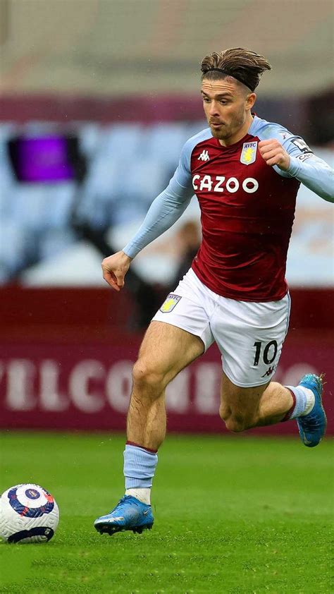 A Soccer Player Is Running With The Ball
