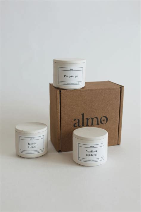 Two White Jars Sitting Next To Each Other On Top Of A Cardboard Box