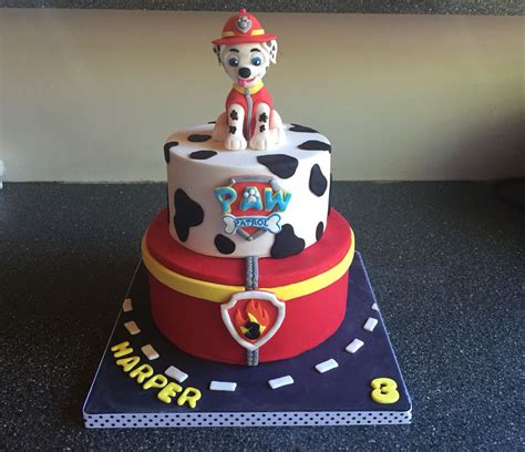 A Birthday Cake Made To Look Like A Fireman On Top Of A Cowgirl