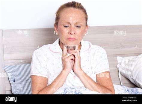 Elderly Woman In Bed With Sore Throat Stock Photo Alamy