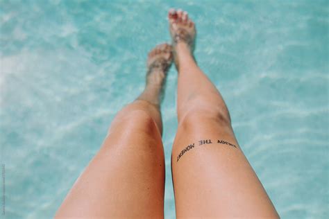 Woman Legs In The Pool by Stocksy Contributor Susana Ramírez Stocksy