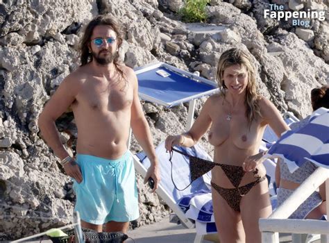 Heidi Klum Shows Off Her Nude Boobs While Enjoying A Summer Holiday