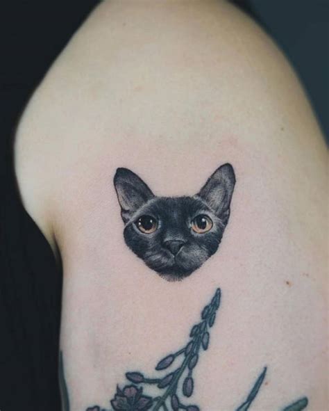 Micro Realistic Black Cat Tattoo On The Upper Arm